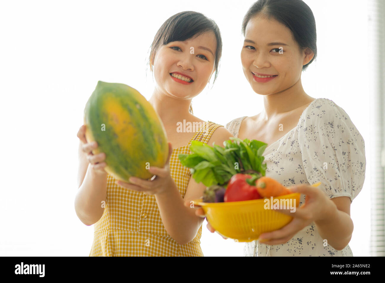 Pretty girls cooking in the kitchen Stock Photo - Alamy