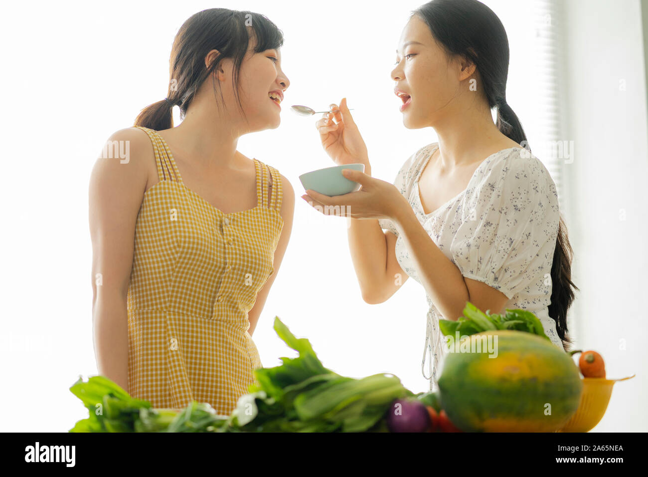 Pretty girls cooking in the kitchen Stock Photo - Alamy