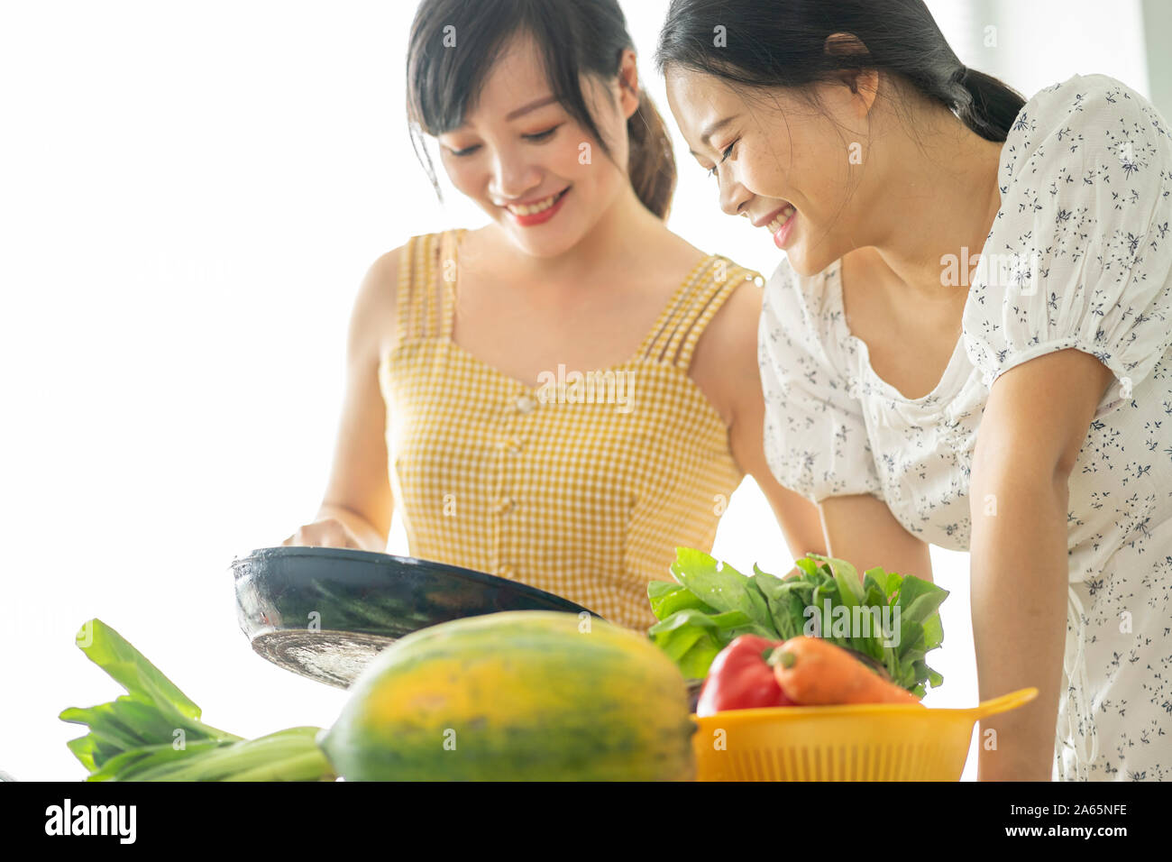 Pretty girls cooking in the kitchen Stock Photo - Alamy