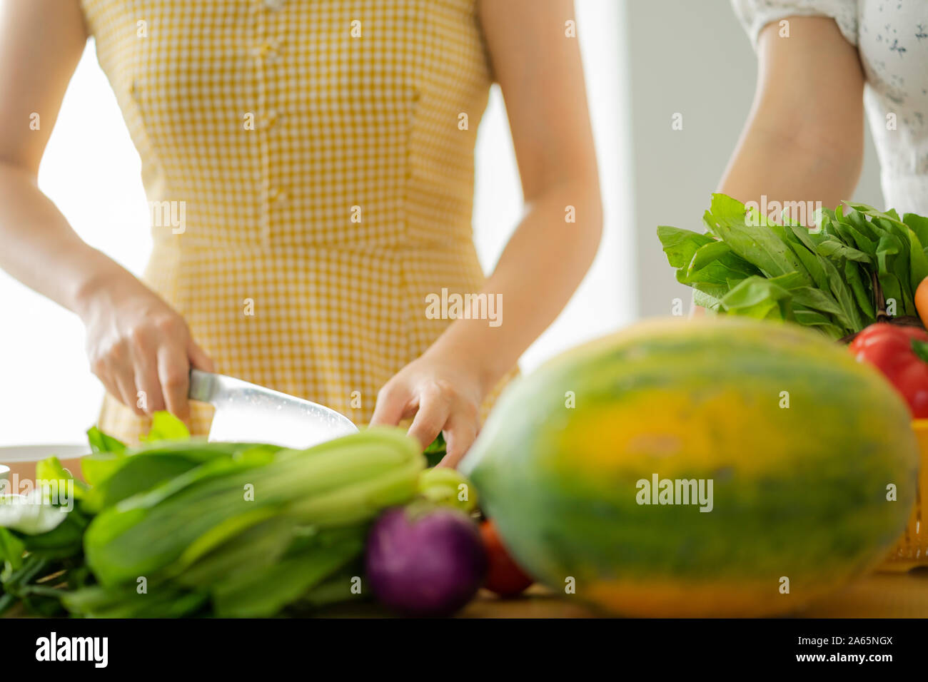 Pretty girls cooking in the kitchen Stock Photo - Alamy