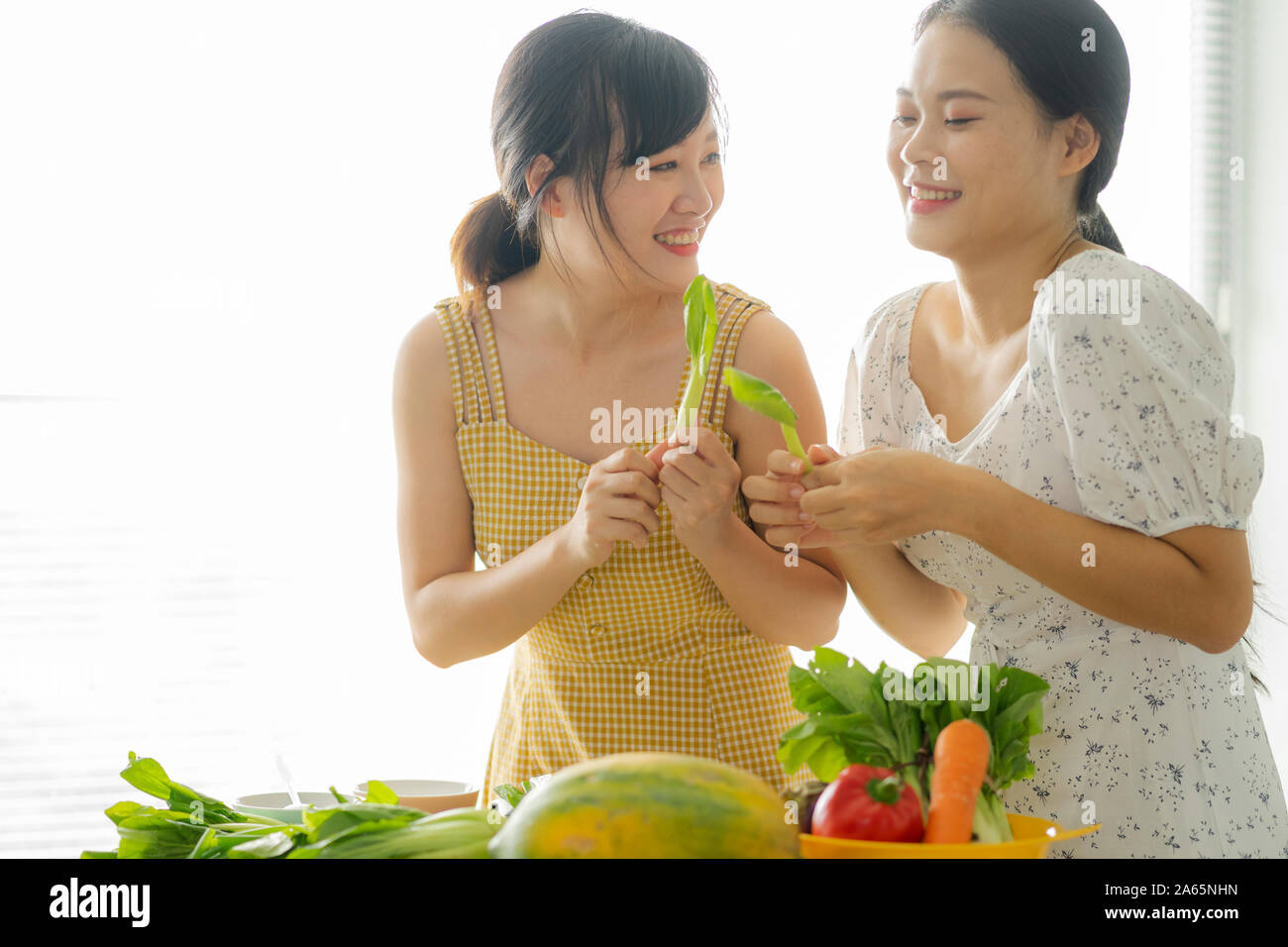 Pretty girls cooking in the kitchen Stock Photo - Alamy