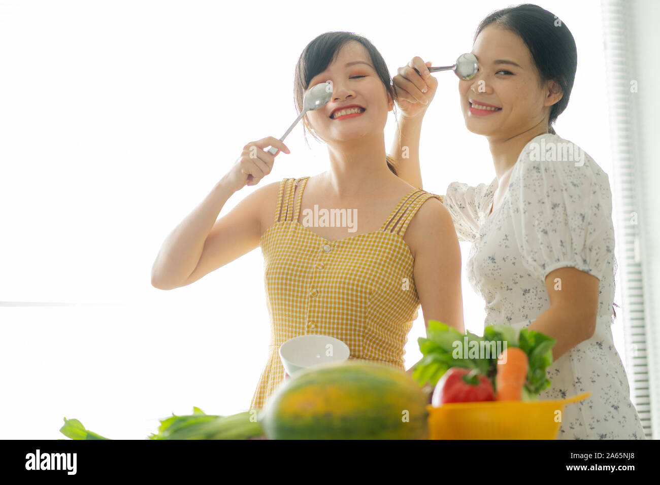 Pretty girls cooking in the kitchen Stock Photo - Alamy