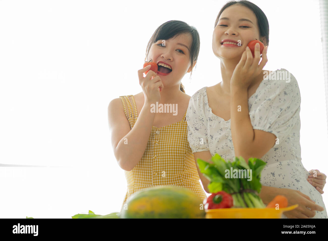 Pretty girls cooking in the kitchen Stock Photo - Alamy