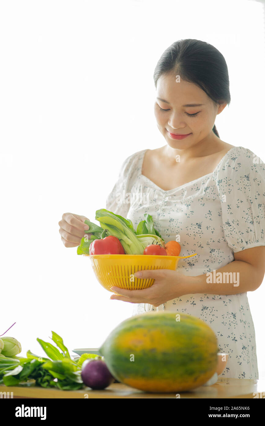 Pretty girls cooking in the kitchen Stock Photo - Alamy
