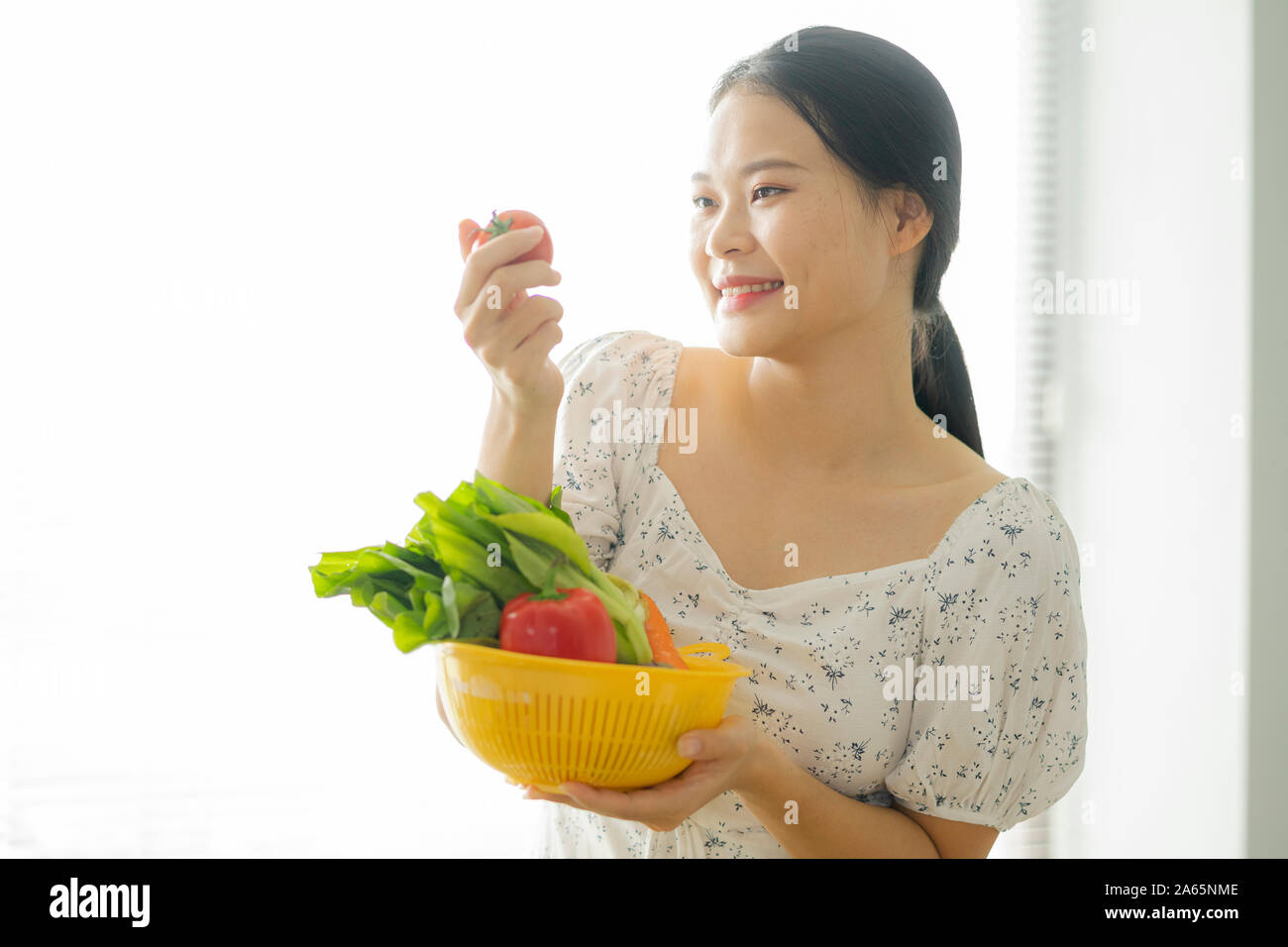 Pretty girls cooking in the kitchen Stock Photo - Alamy