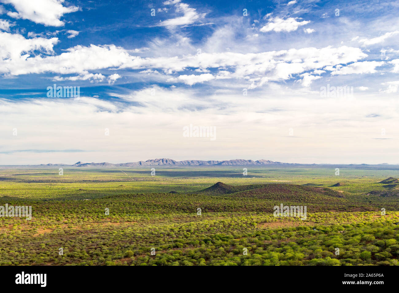 Scenic landscape of the Erongo region with blue sky, green trees and ...