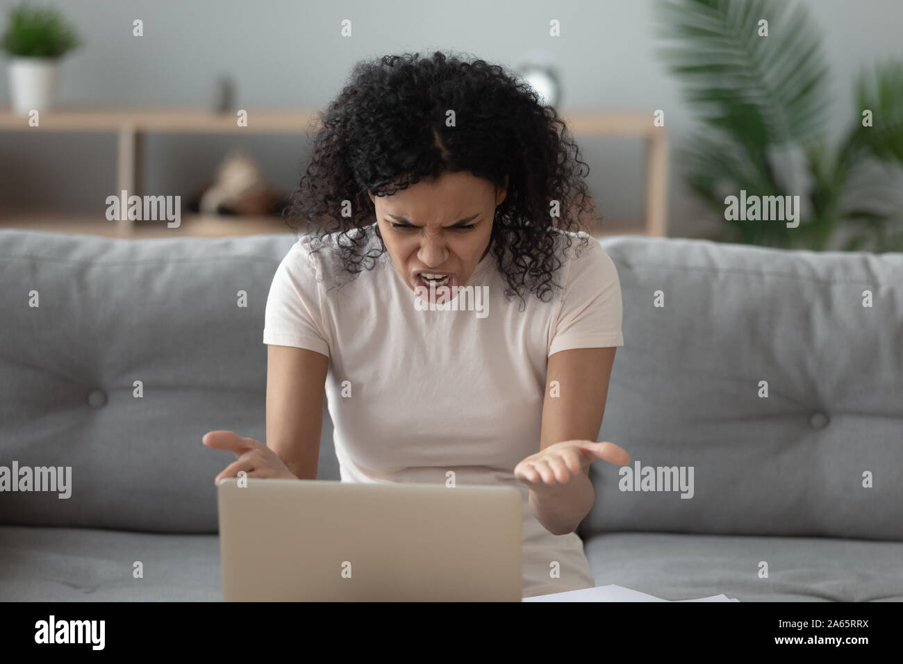 African american woman computer mad hi-res stock photography and images ...