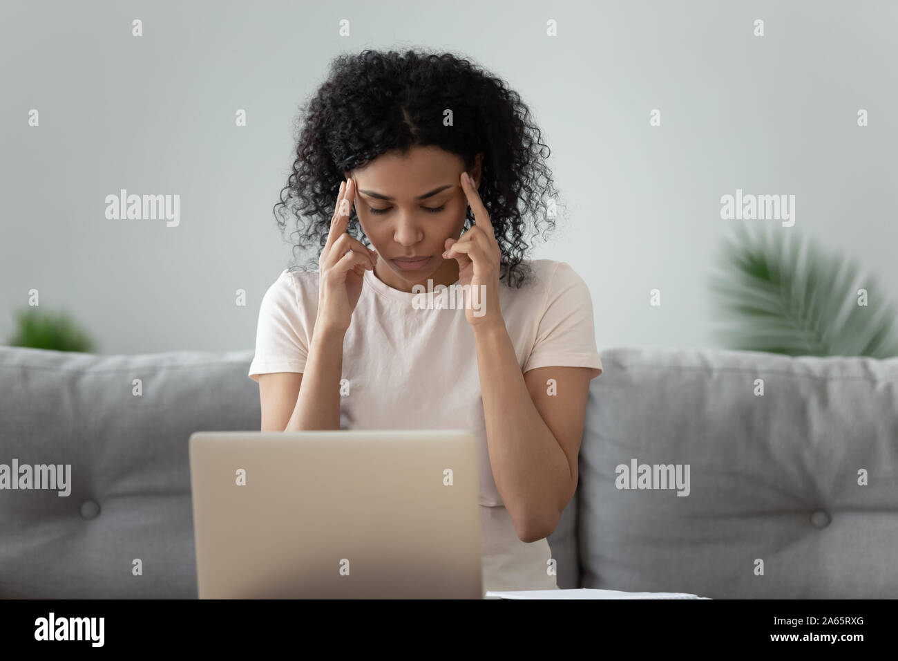 Unhealthy black woman having headache overwhelmed with computer work ...