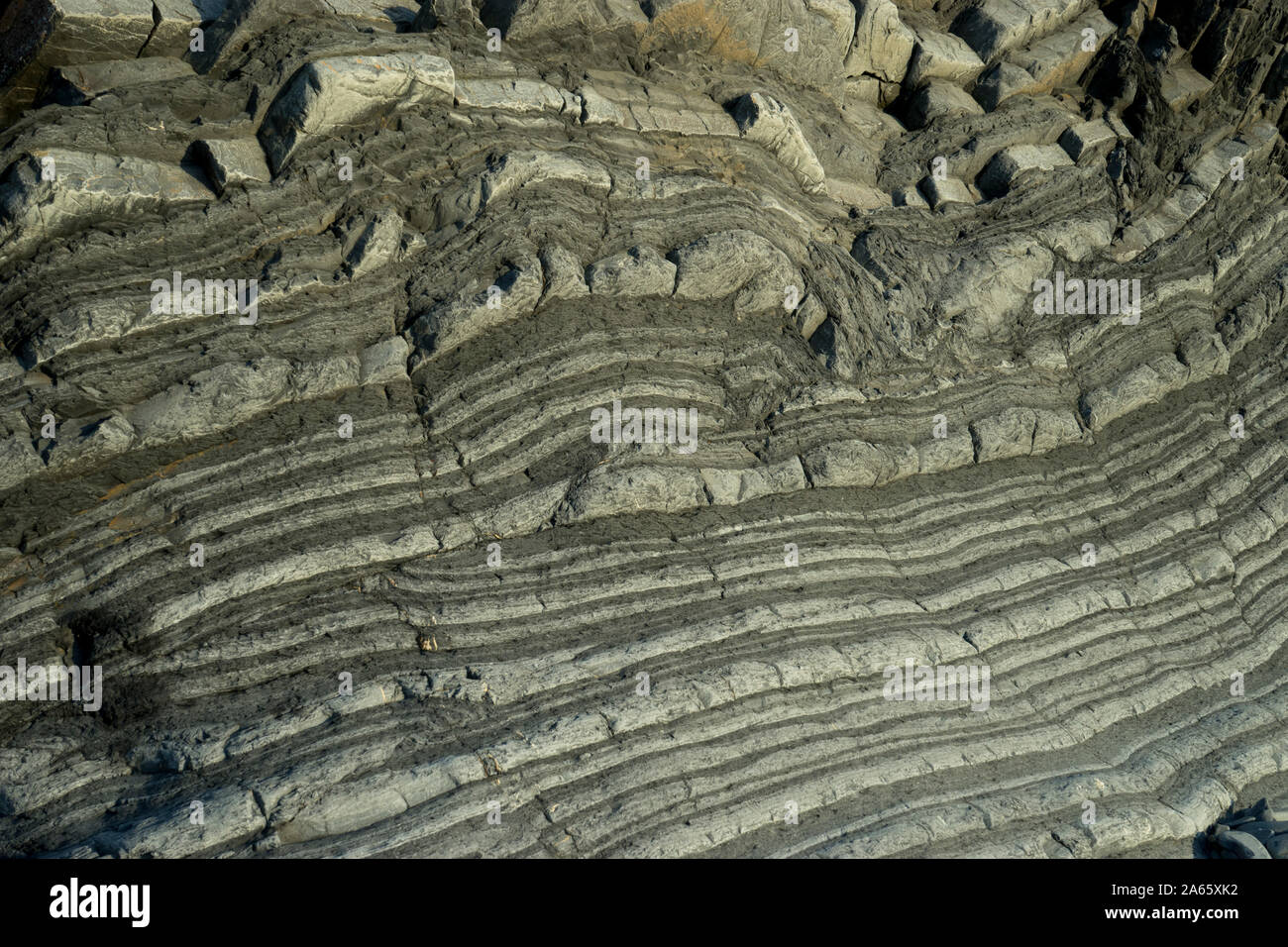 Beach with stacked limestone strata in Ceredigion, Wales,UK Stock Photo ...