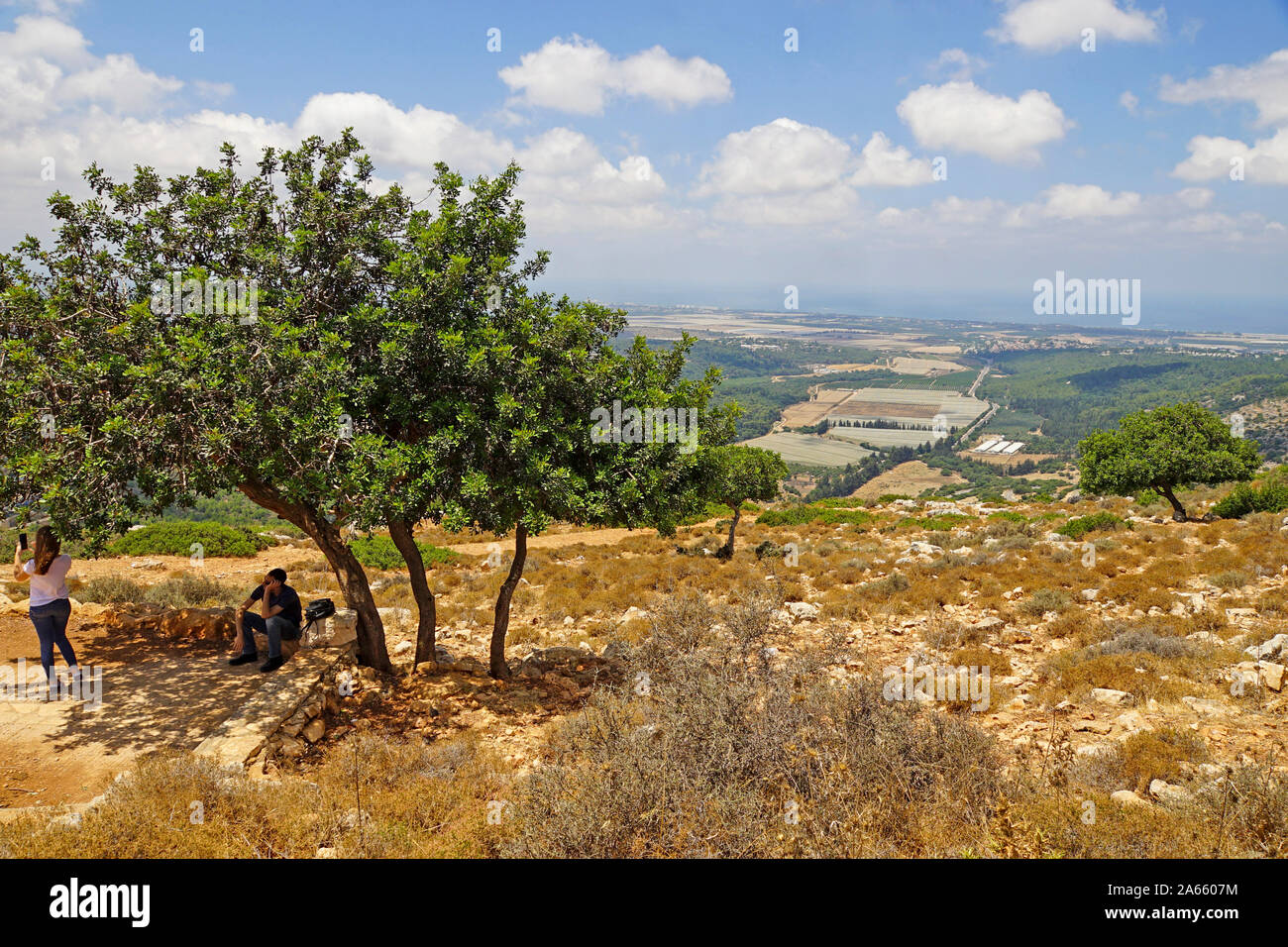 Hikers at the Keshet Cave (Arch Cave) in Adamit Park, Western Galilee ...