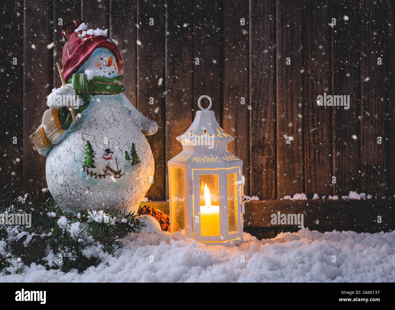 Falling snow on snowman hi-res stock photography and images - Alamy