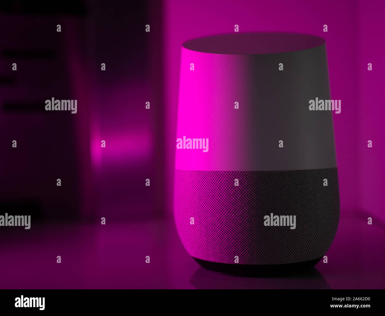 Smart home speaker assistant device in moody coloured LED lighting ...