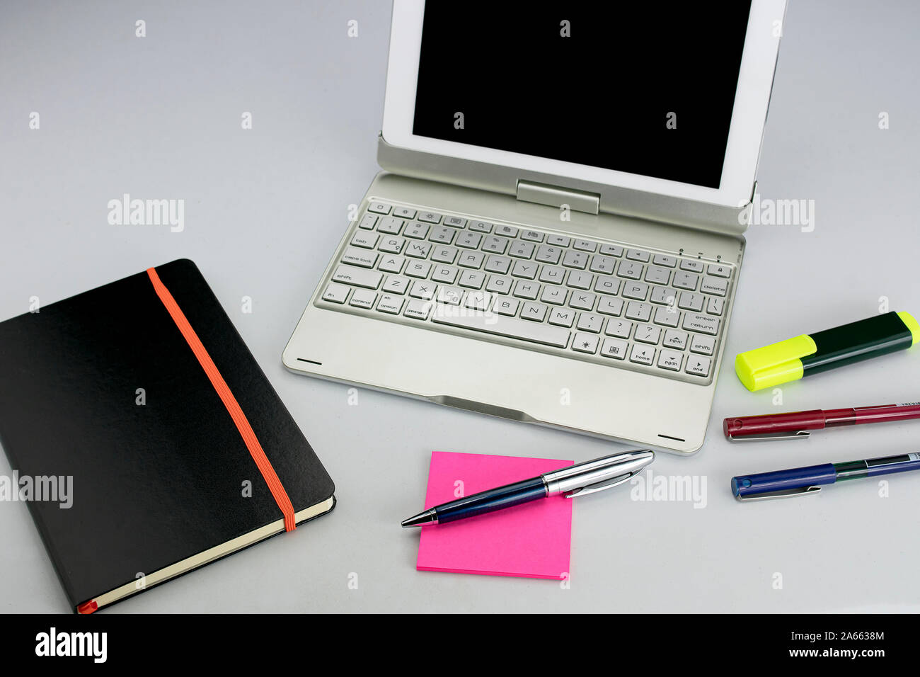 Tablet with keyboard, fluorescent marker, red and blue markers, pen ...