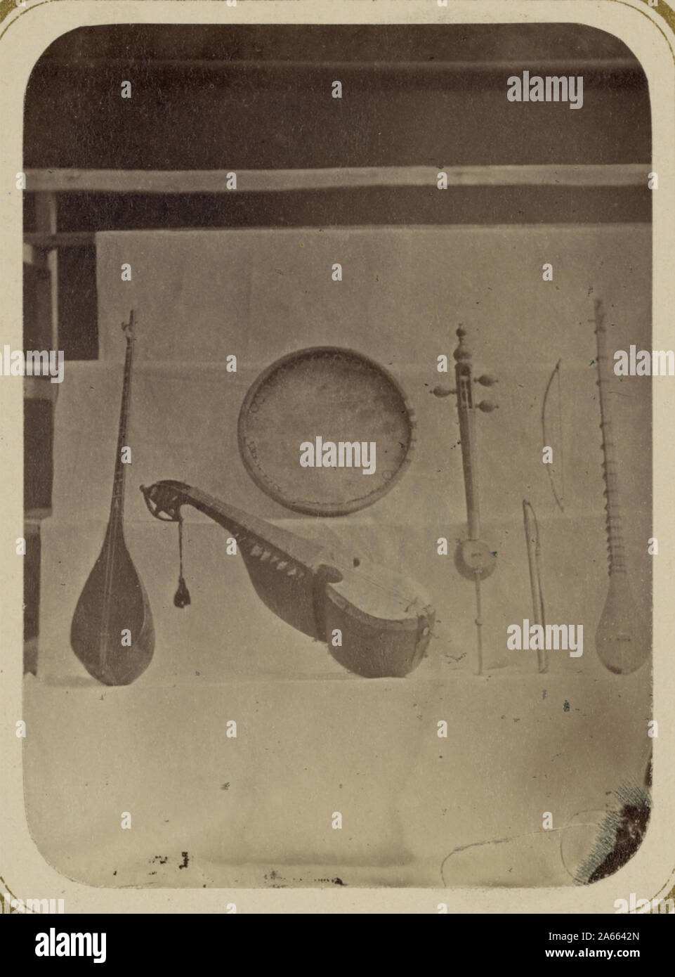 Musical Instruments and Musicians Stringed Instruments and a Frame Drum ...