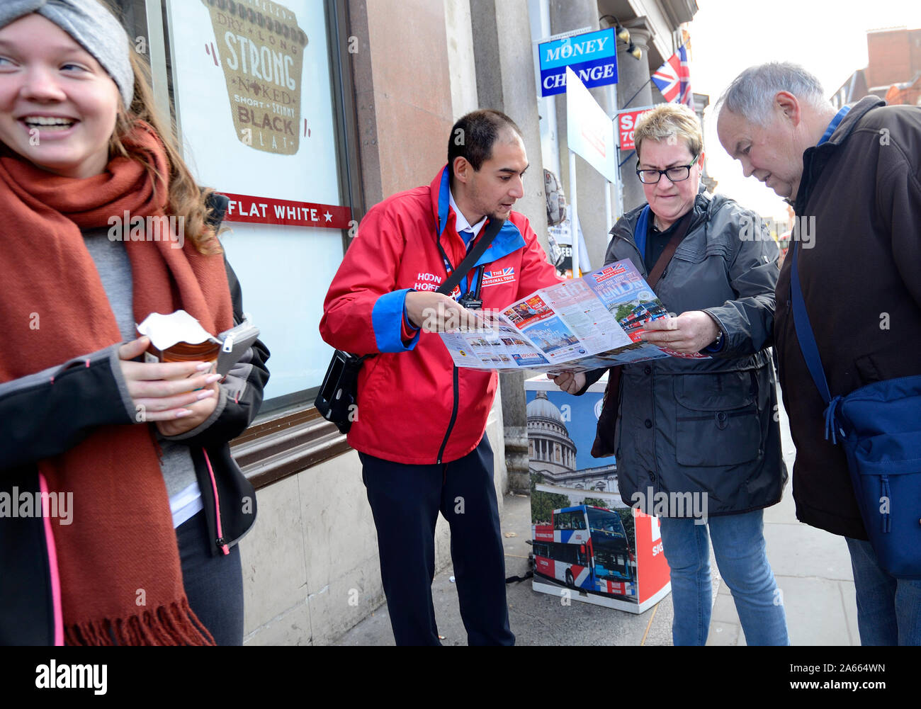 London, England, UK. Tourists in Whitehall looking at a map with a Hop ...