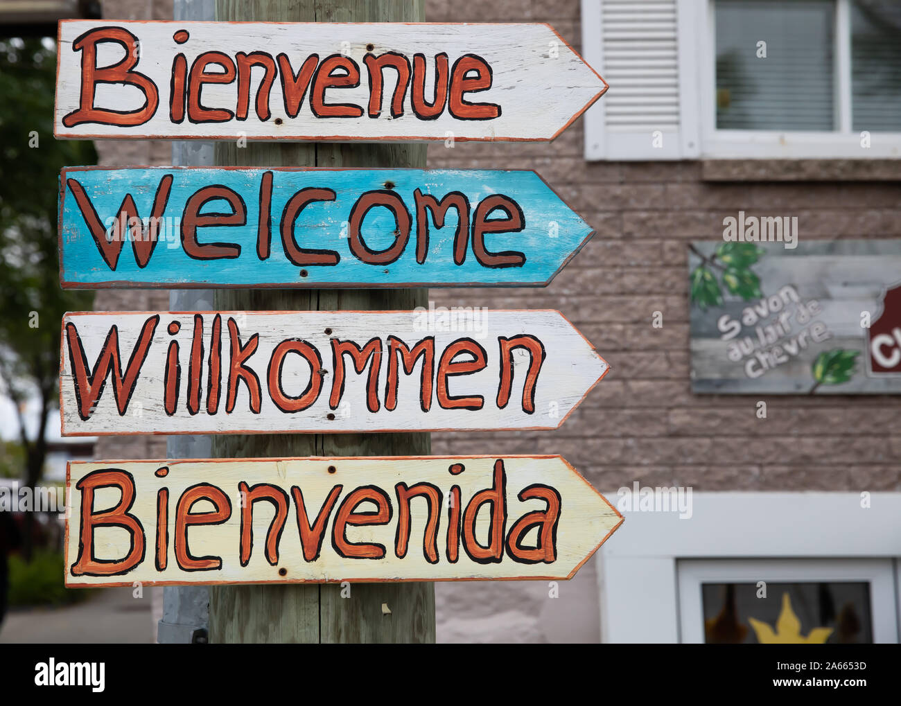 Welcome sign written in four different languages in Saguenay, Canada ...