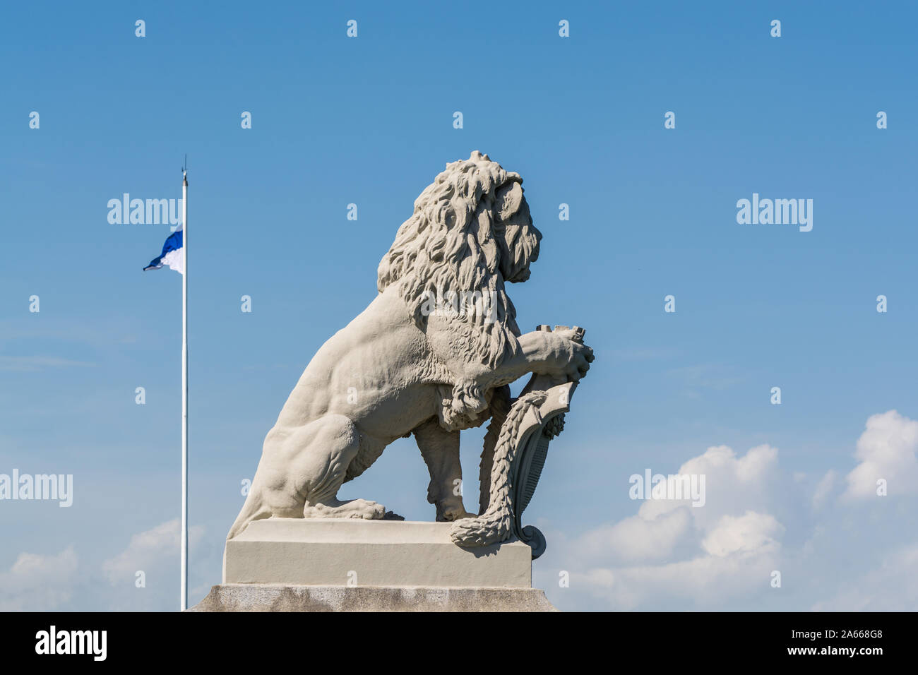 Statue of Lion holding a fish at the Zurich lake, Switzerland Stock ...