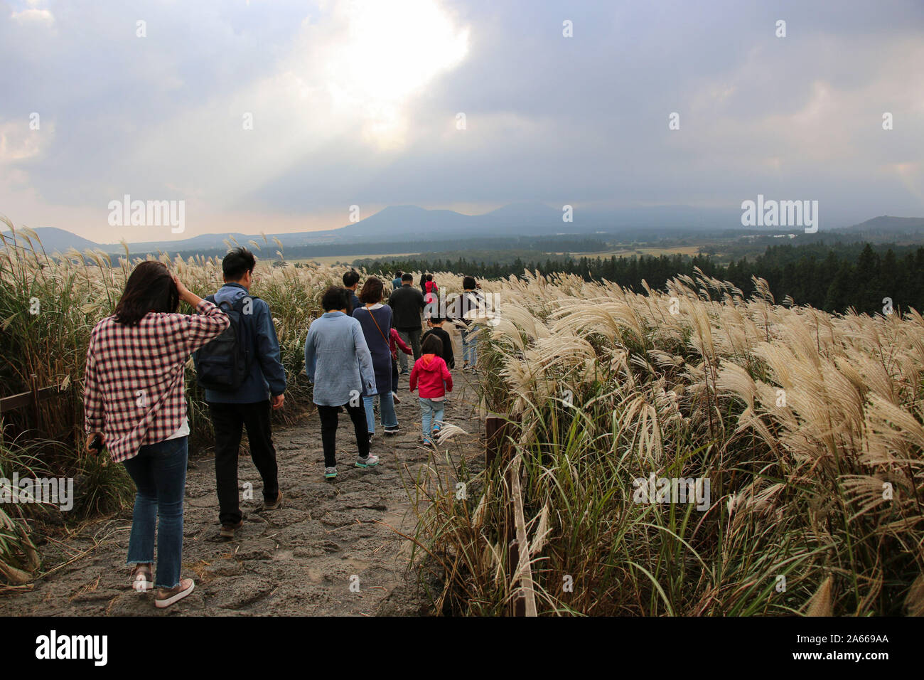 Tourists walk along mountain road hi-res stock photography and images ...