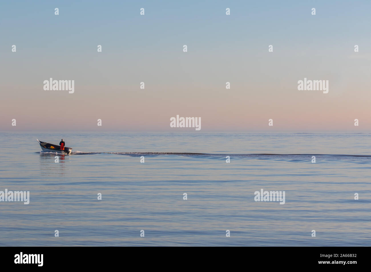 A lone boat out at sea hi-res stock photography and images - Alamy
