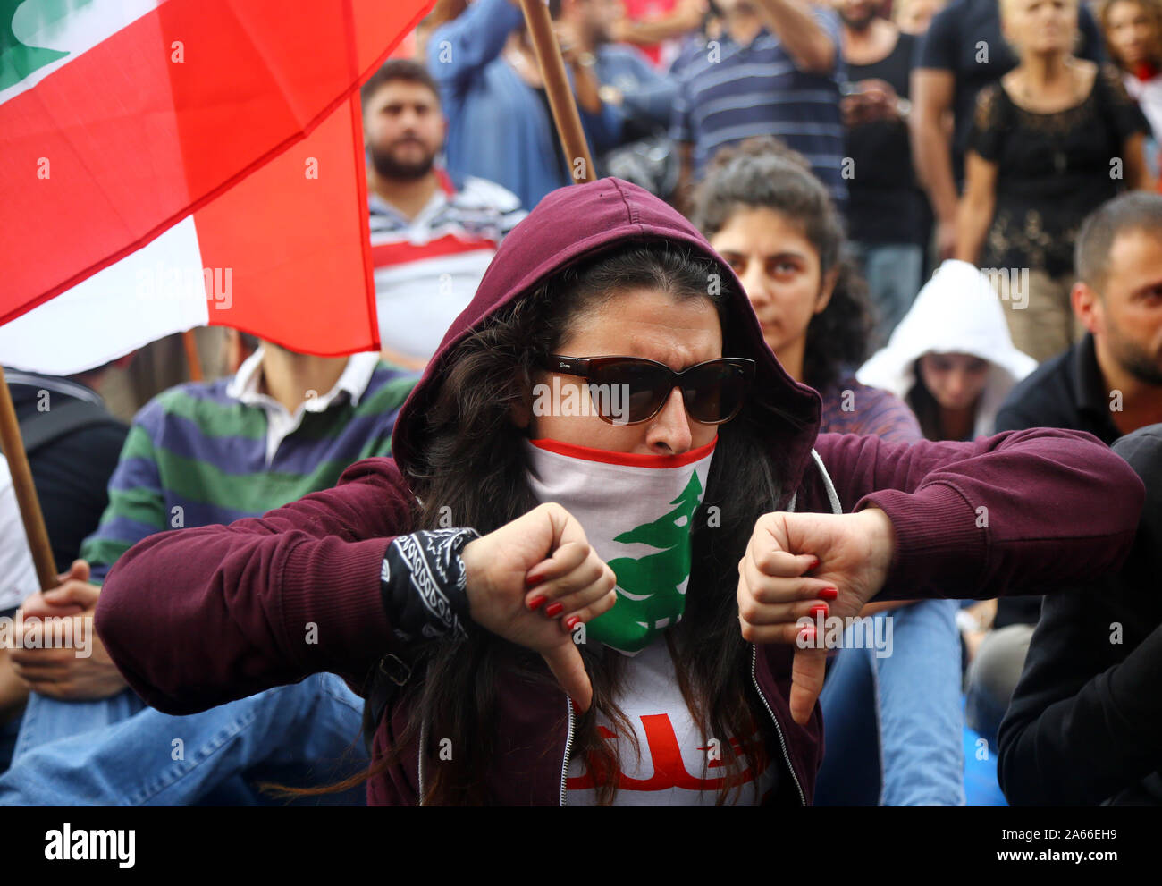 Jal El Dib, Lebanon. 24th Oct, 2019. A demonstrator reacts as she ...