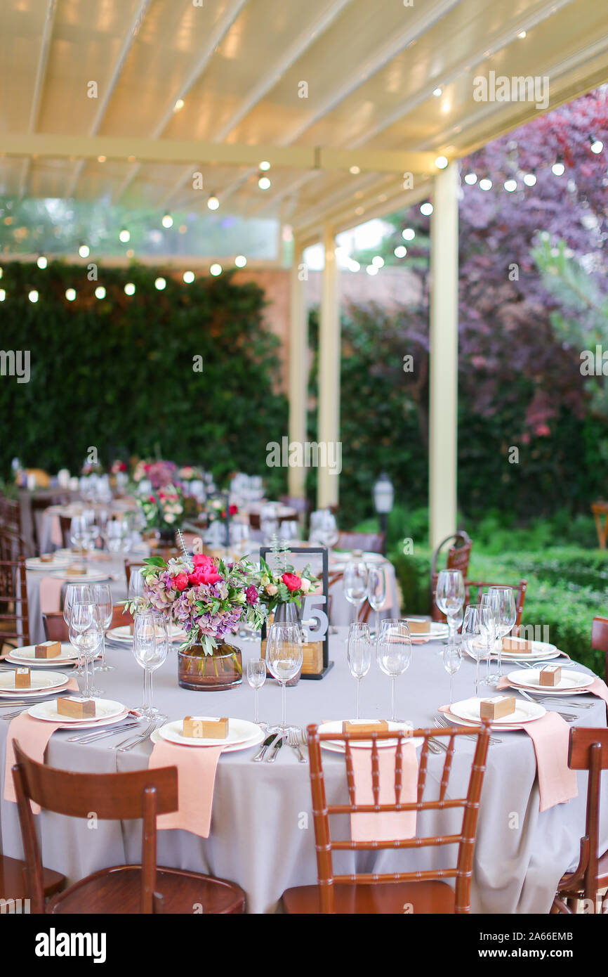 Banquet decorated tables at restaurant in open air Stock Photo - Alamy