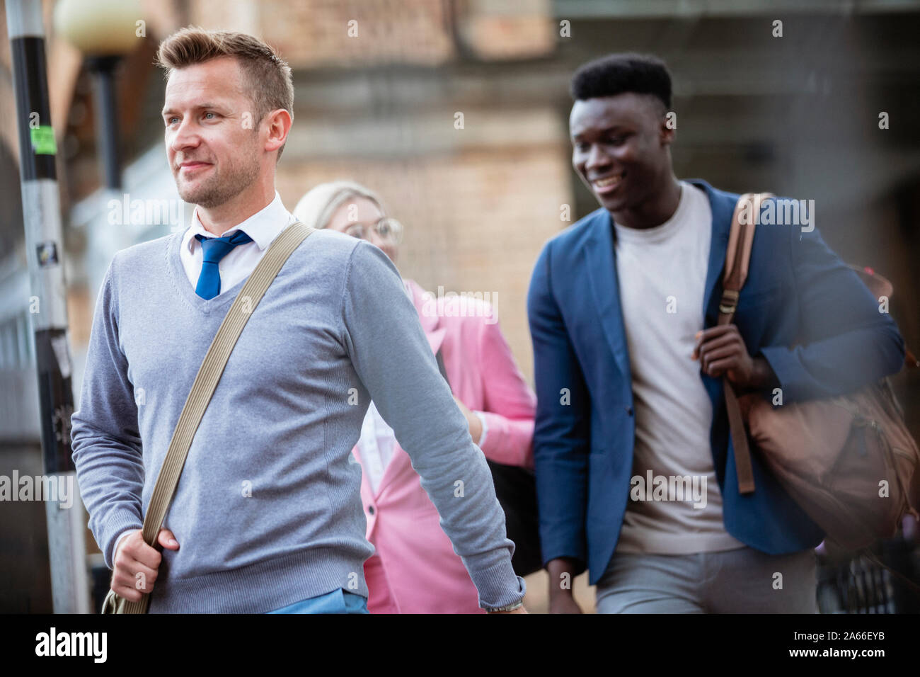 Businesspeople walking home after a day of work. The main focus is on ...