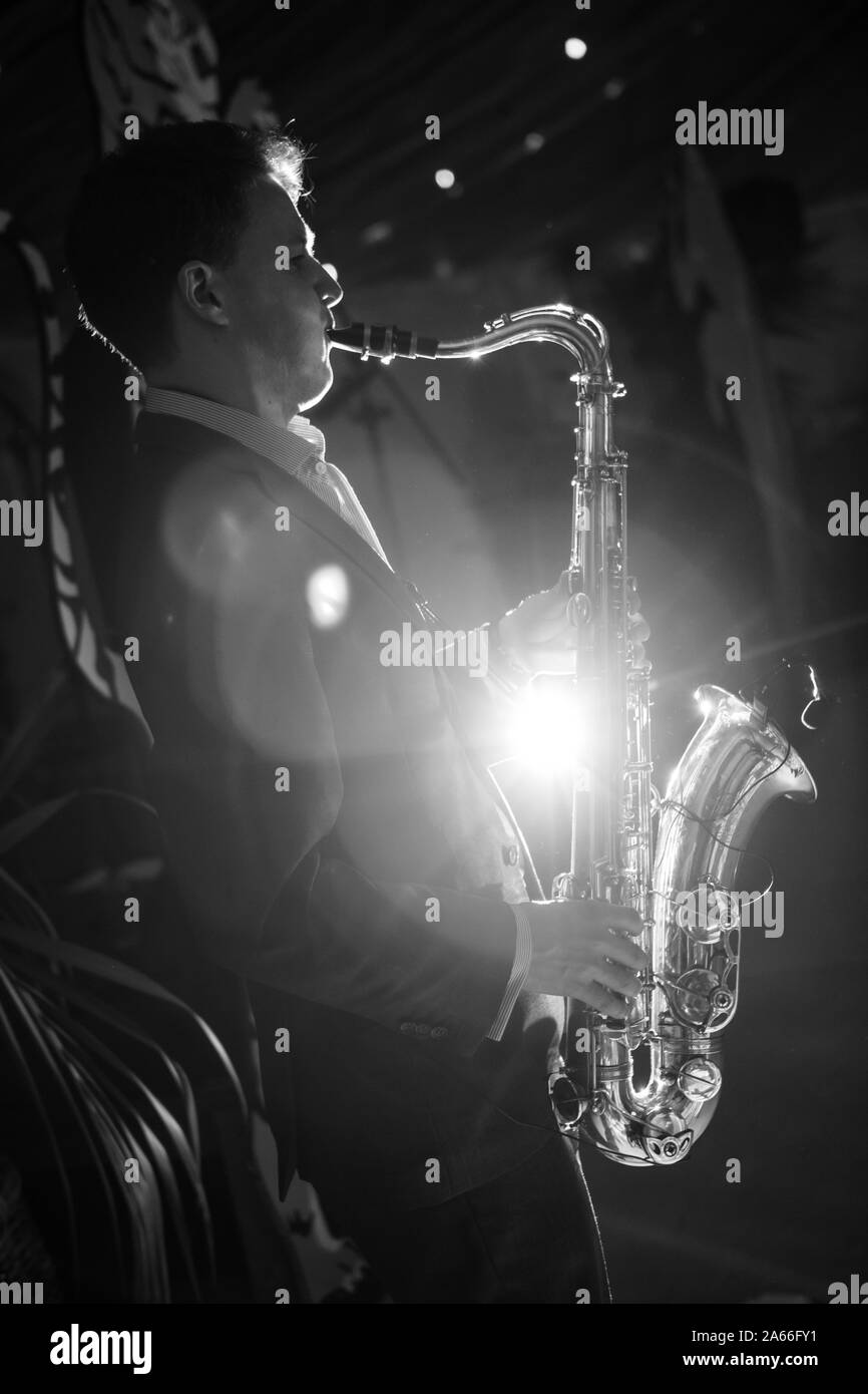 Black man playing sax in hi-res stock photography and images - Alamy