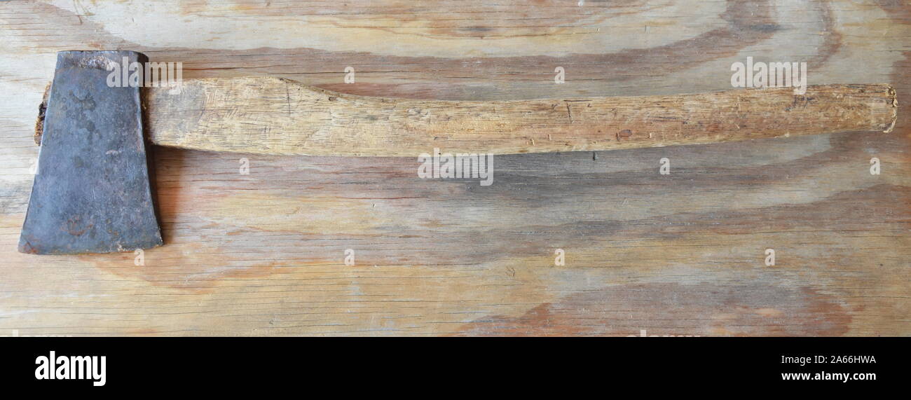 iron ax blade with wooden handle on plank Stock Photo - Alamy