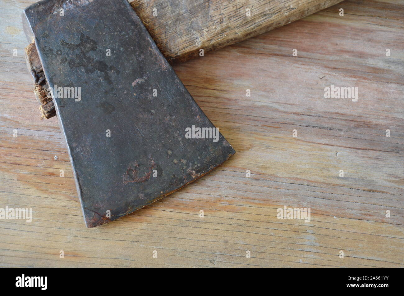 iron ax blade with wooden handle on plank Stock Photo - Alamy