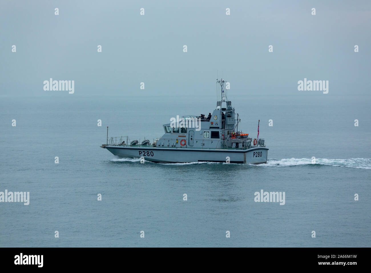 Royal Naval Patrol Boat HMS Dasher P280 leaving port on a foggy morning ...