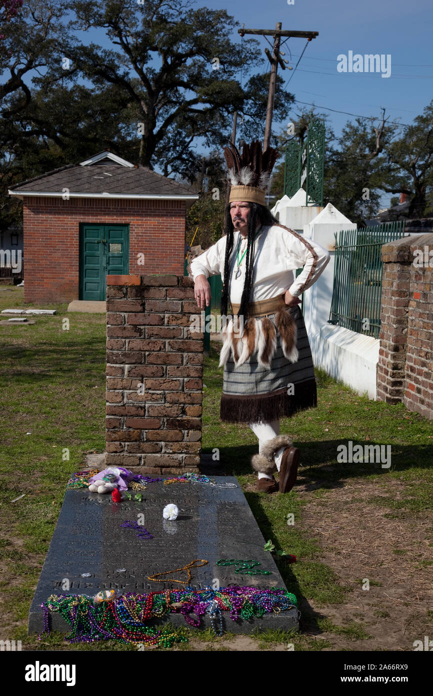 Wayne Dean, dressed as Joe Cain, Jr., poses at the grave of Joseph ...