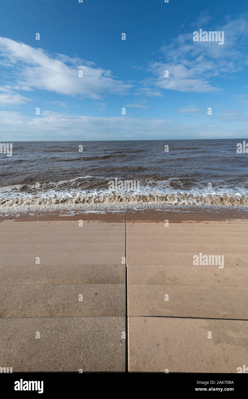 Sea waves breaking on the promenade steps in Blackpool, Lancashire, UK ...