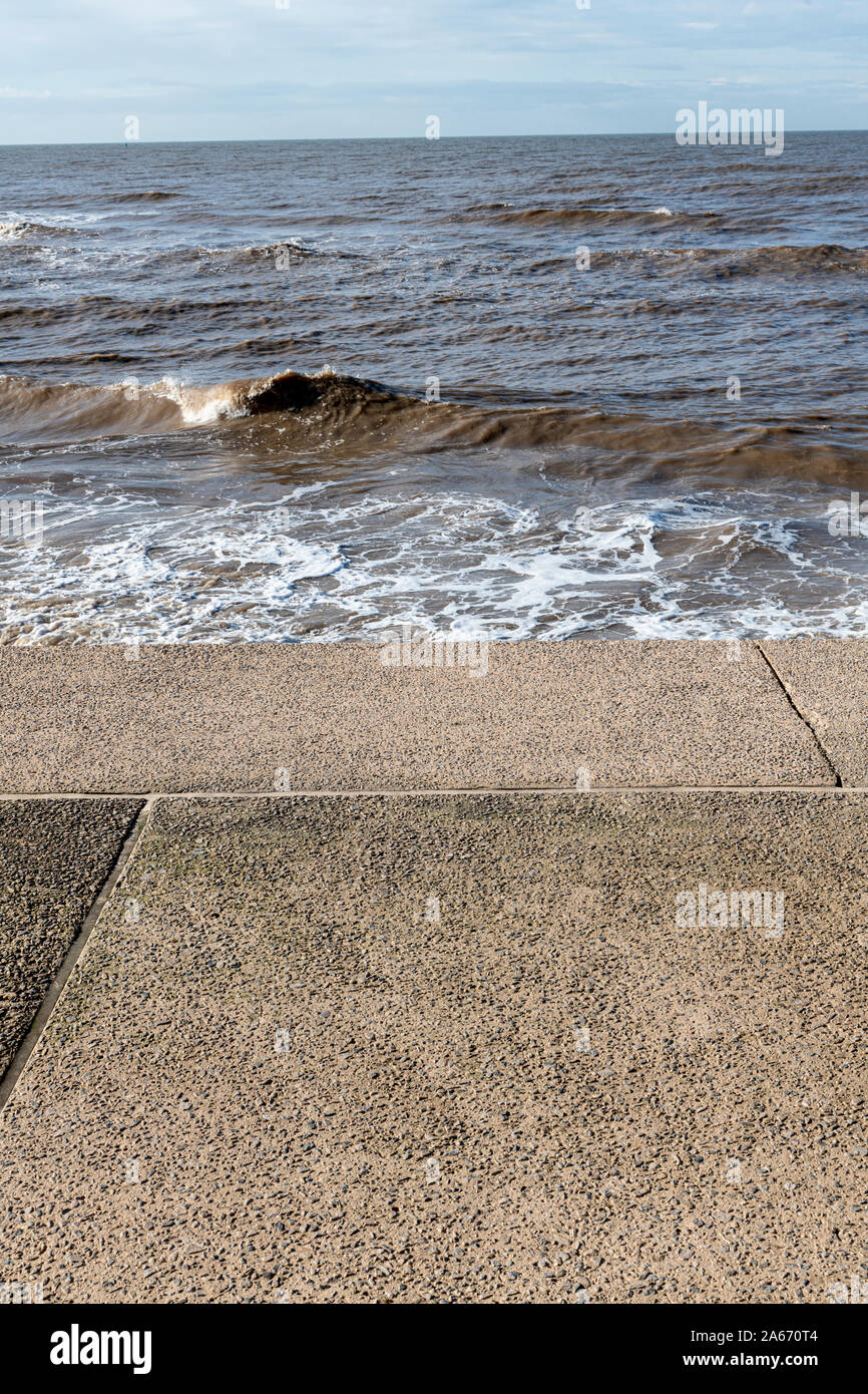 Sea waves breaking on the promenade steps in Blackpool, Lancashire, UK ...