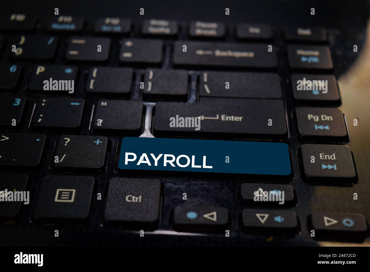 Payroll write on keyboard isolated on laptop background Stock Photo - Alamy