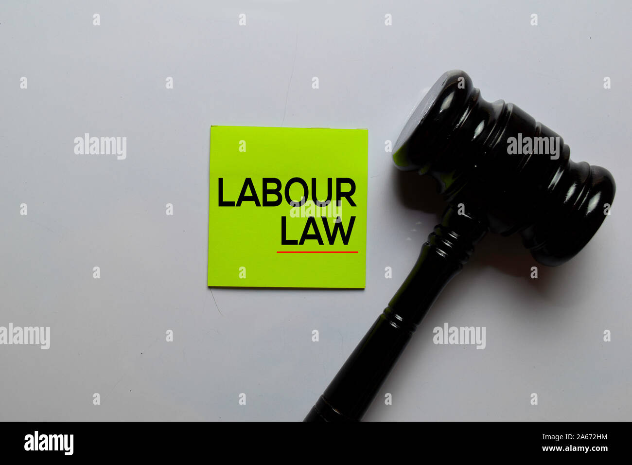 Labour Law write on sticky notes. Isolated on white table background ...