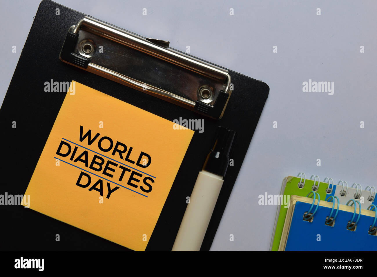 World Diabetes Day write on sticky notes. Isolated on white table ...