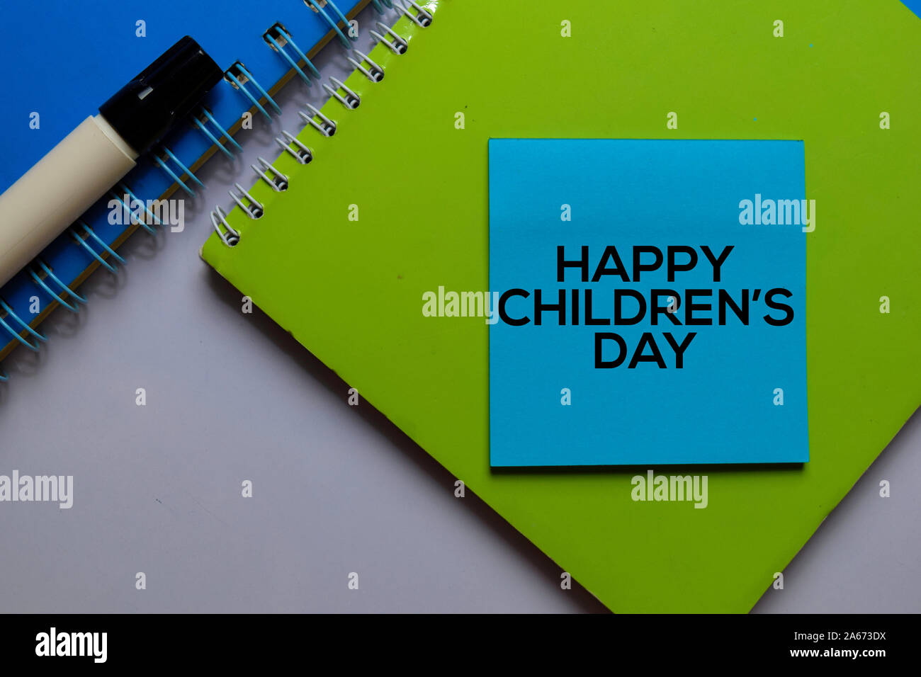 Happy Children's Day write on sticky notes. Isolated on white table ...