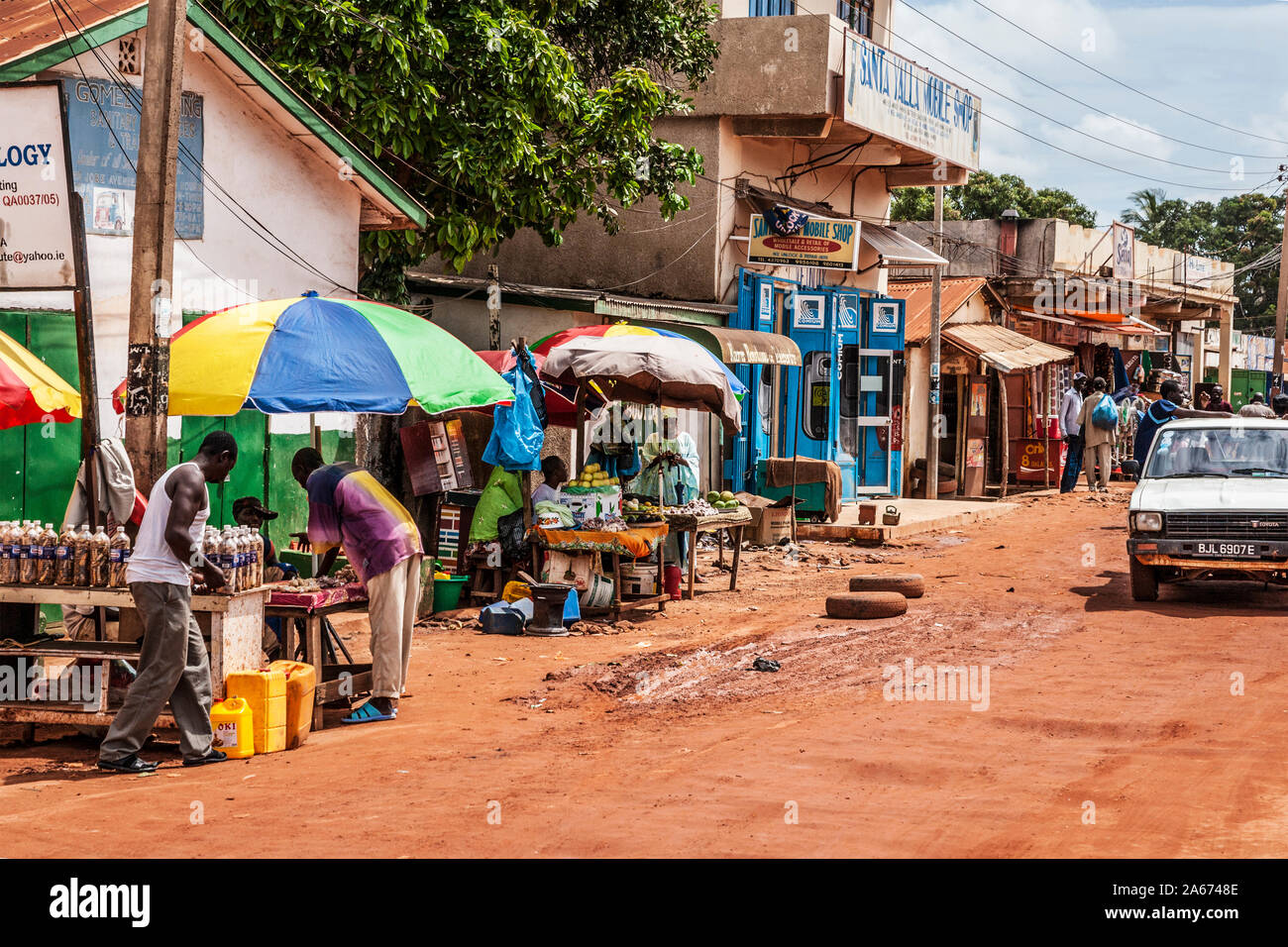 A busy street scene in Serrekunda in The Gambia, West Africa Stock ...