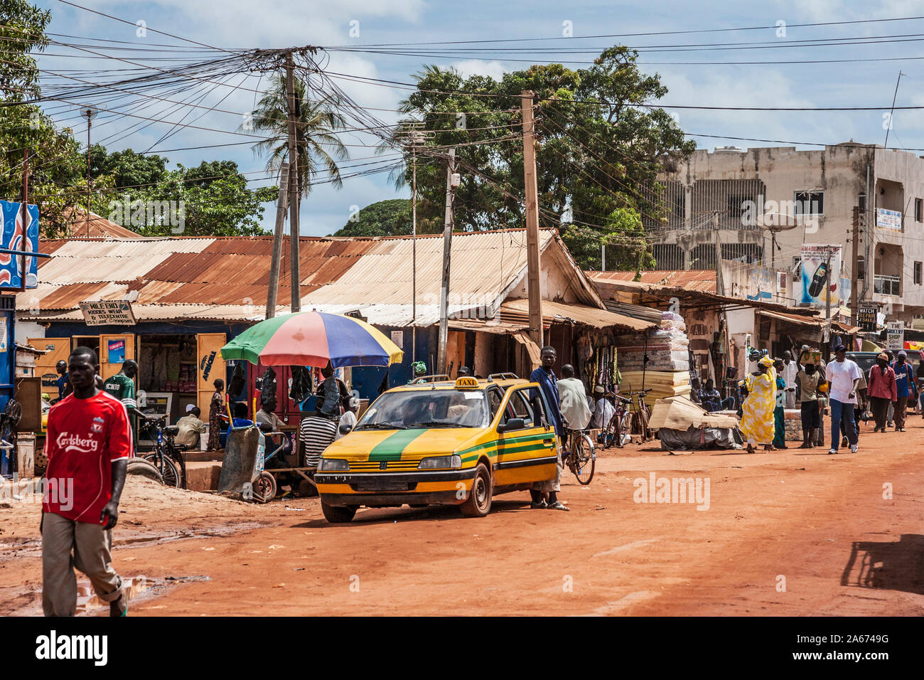 A busy street scene in Serrekunda in The Gambia, West Africa Stock ...