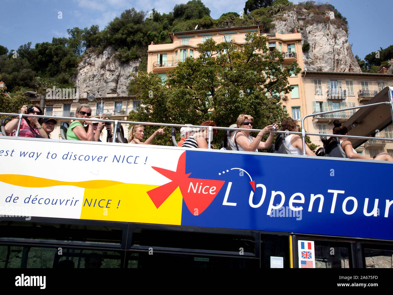 The city of Nice on the French Riviera. Tour bus with tourists.Photo ...