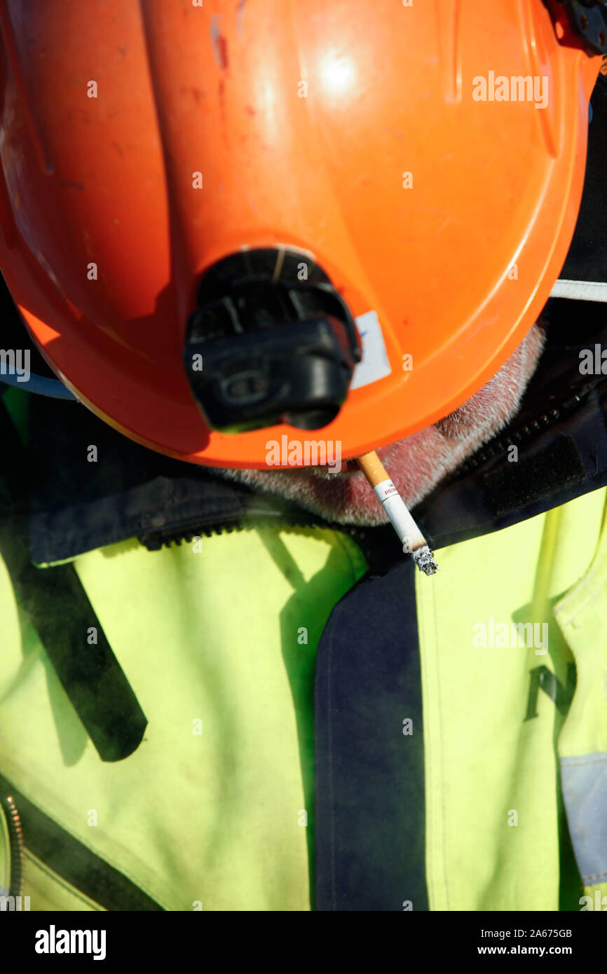 Construction worker smoking at work.Photo Jeppe Gustafsson Stock Photo ...