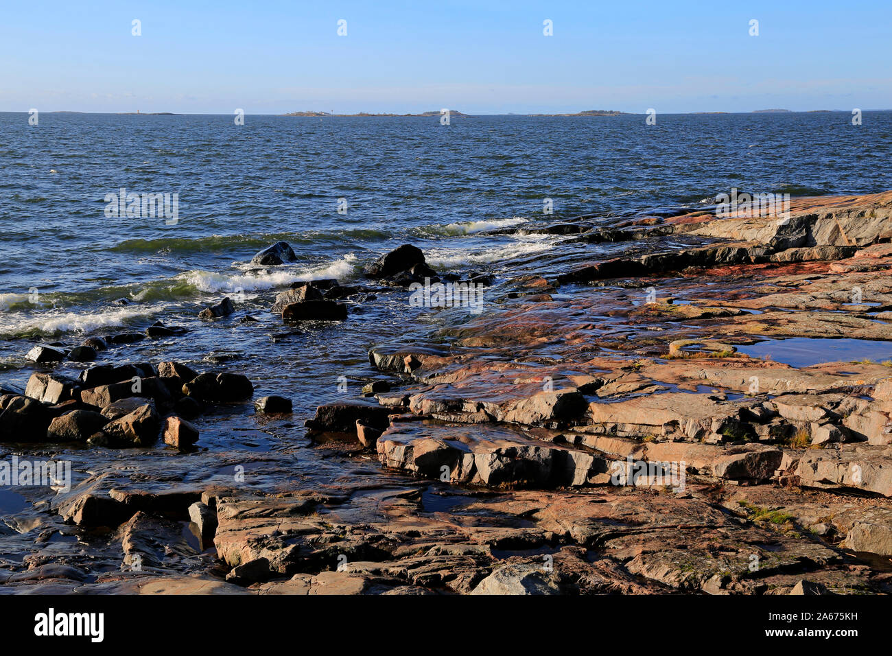 Seaside rocks with view to the blue sea on Kustaanmiekka, the ...