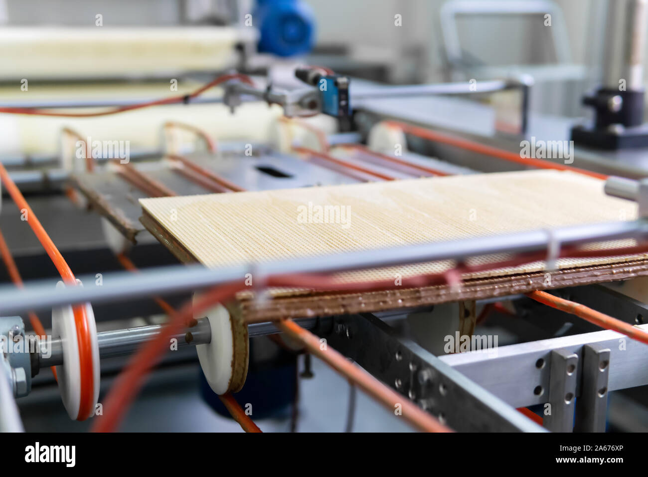 finished multi-layer wafer moves on the conveyor of a confectionery ...
