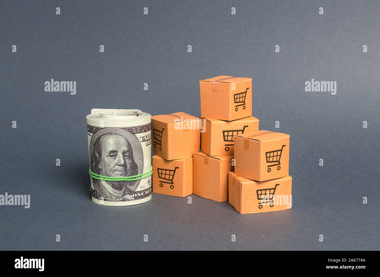 Roll bundle of dollars and cardboard boxes. International trade and ...