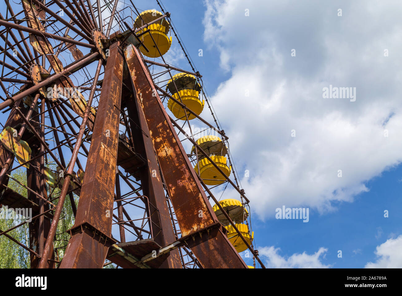 Old broken rusty metal radioactive electric wheel abandoned, the park ...