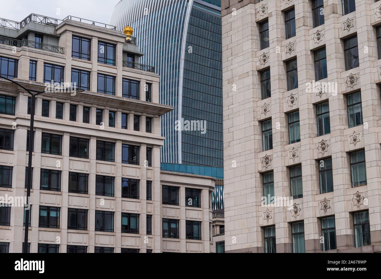 Classic architecture in City of London with skyscrapers in background ...