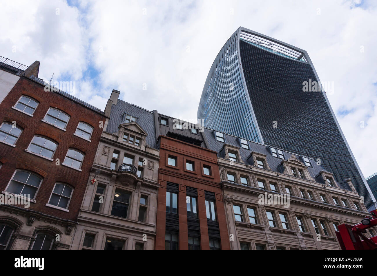 Classic architecture in City of London with skyscrapers in background ...