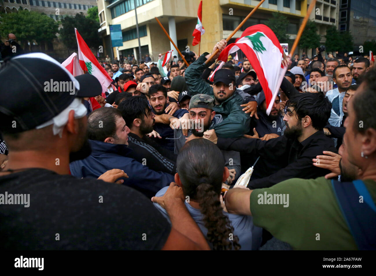Beirut, Lebanon. 24th Oct, 2019. Supporters of pro-Iranian Hezbollah (L ...
