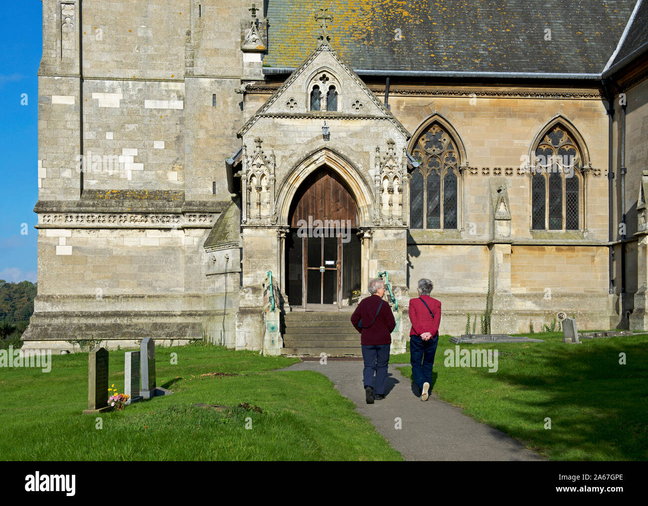 Two elderly women visiting St Mary's Church in the village of South ...