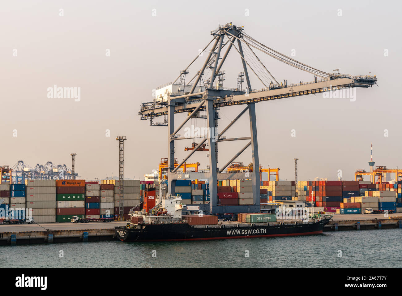 Laem Chabang seaport, Thailand - March 17, 2019: Black small Chalalai 2 container feeder boat ...